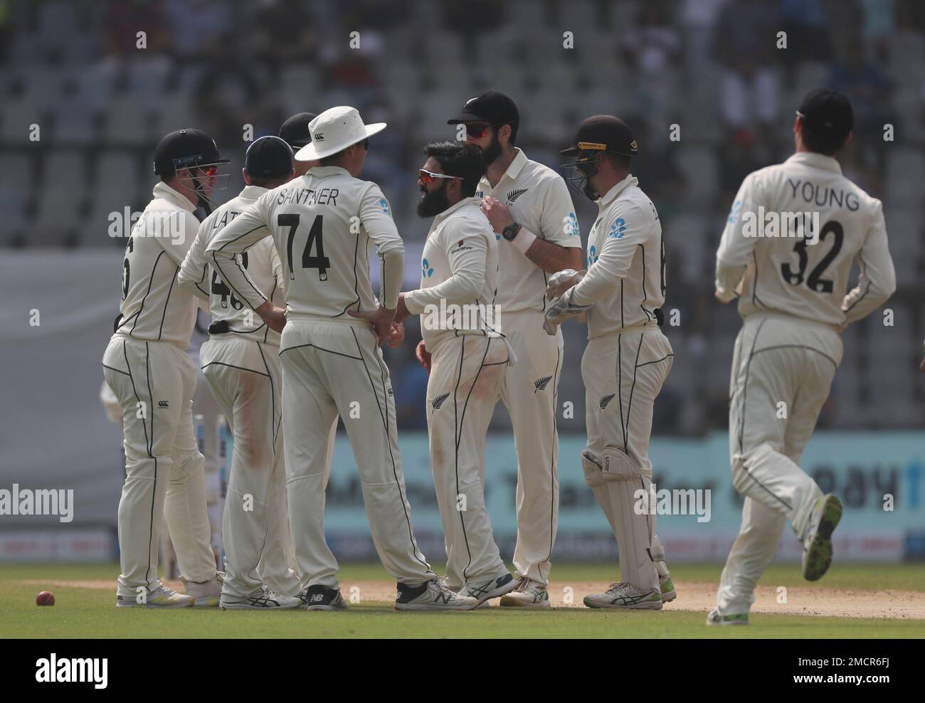 New Zealand's Ajaz Patel , center, celebrates the dismissal of India's ...