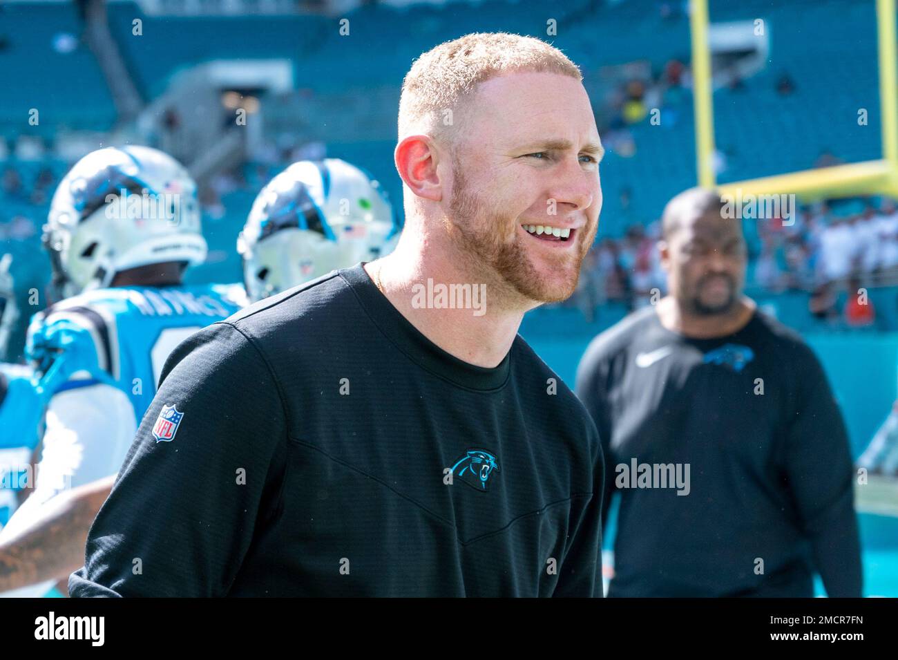Carolina Panthers offensive coordinator Joe Brady smiles as he greets ...