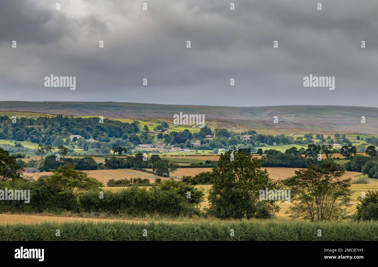 A brief break in the otherwise grey sky produces a bright spot on the ...