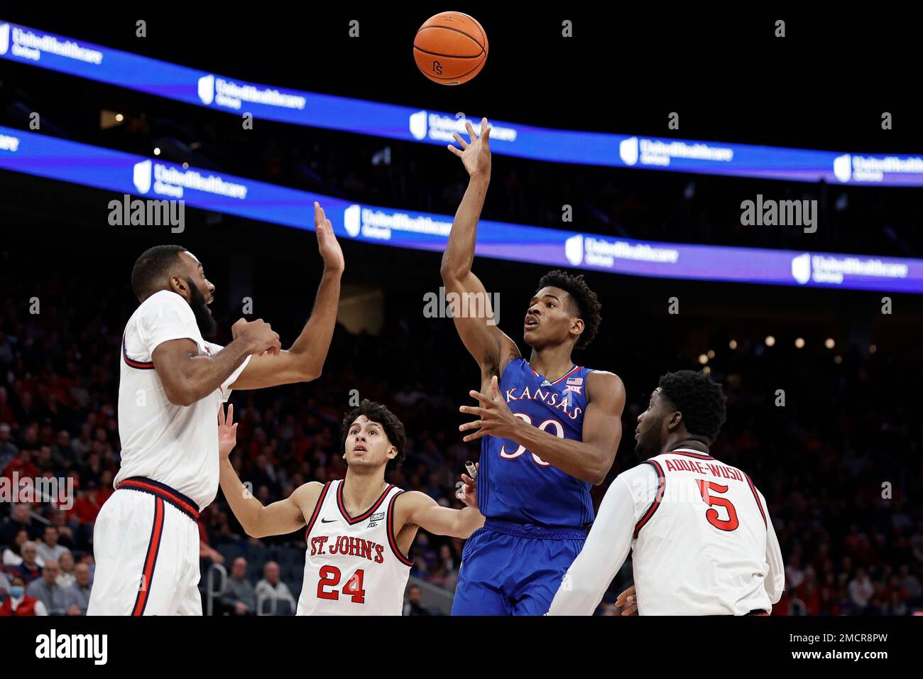 Kansas guard Ochai Agbaji (30) shoots next to St. John's guard Rafael ...