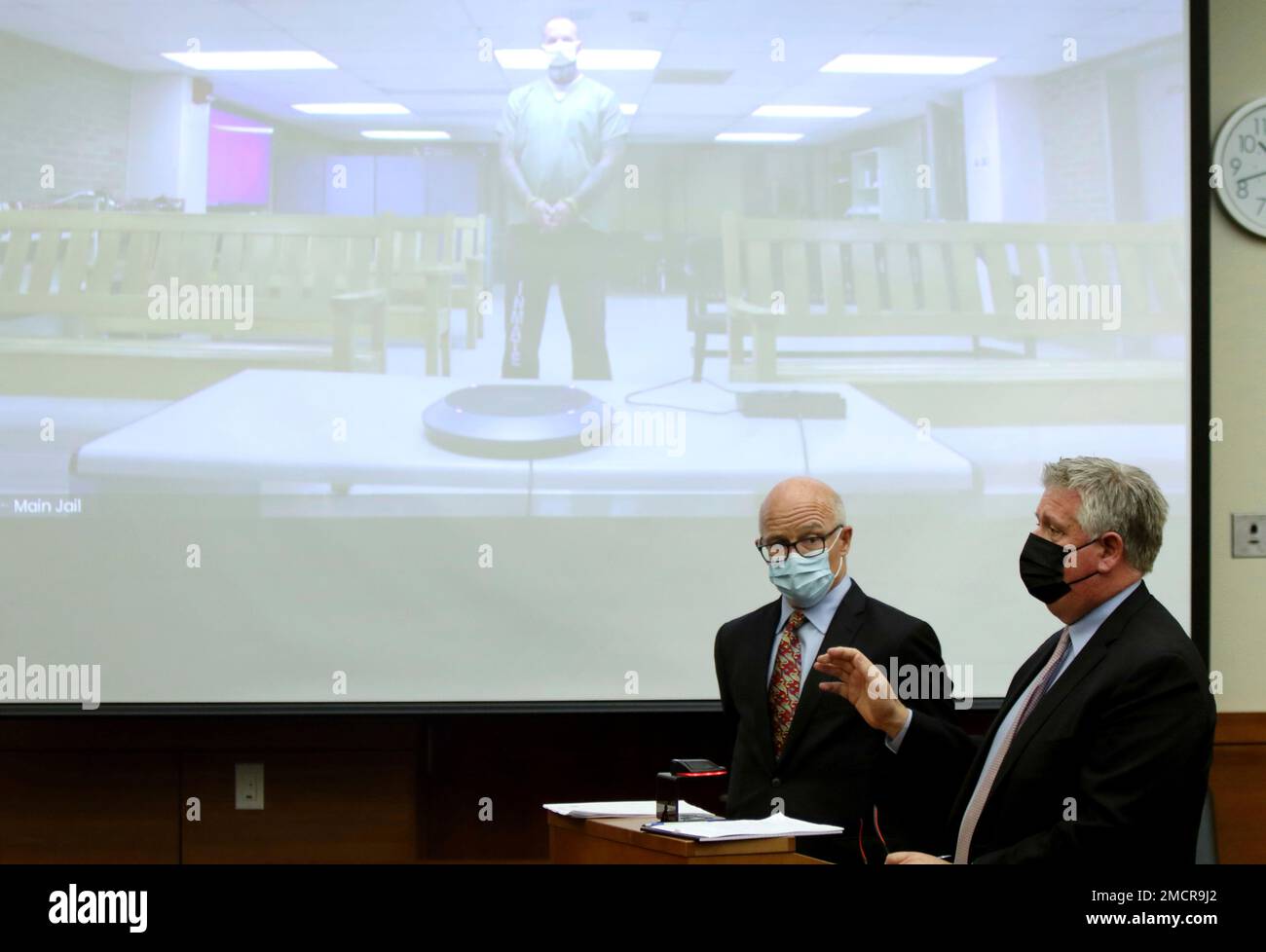 Defense attorney Mark Collins, right, speaks to the judge as defense ...