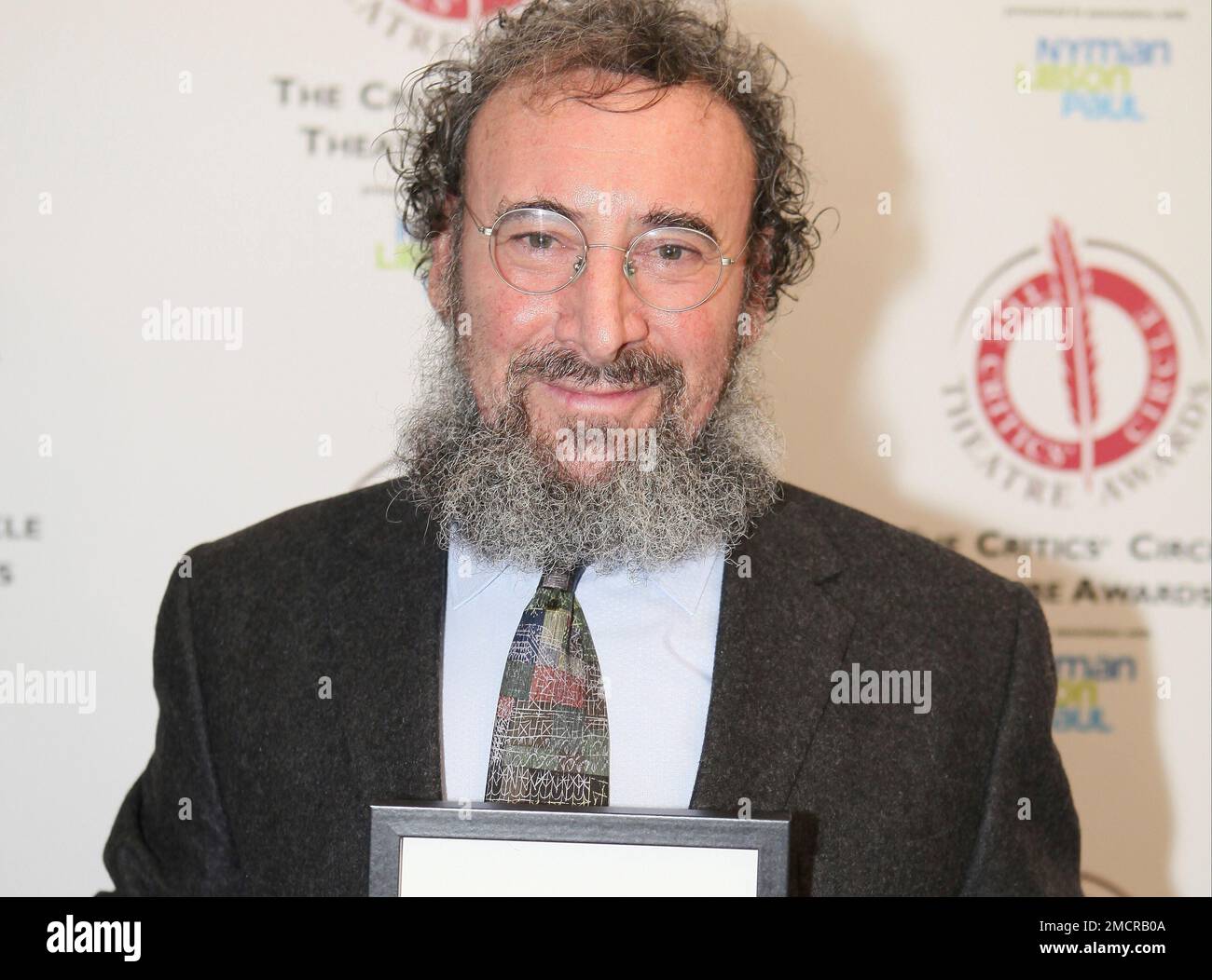 FILE - Actor Antony Sher poses for photographers after winning the best ...