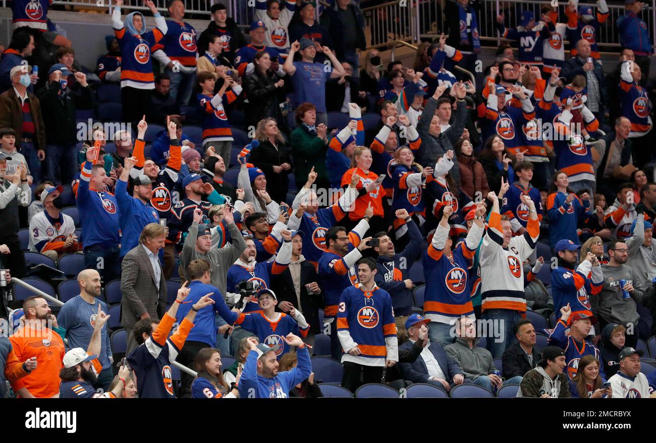 New York Islanders fans cheer after their team scored a goal against ...