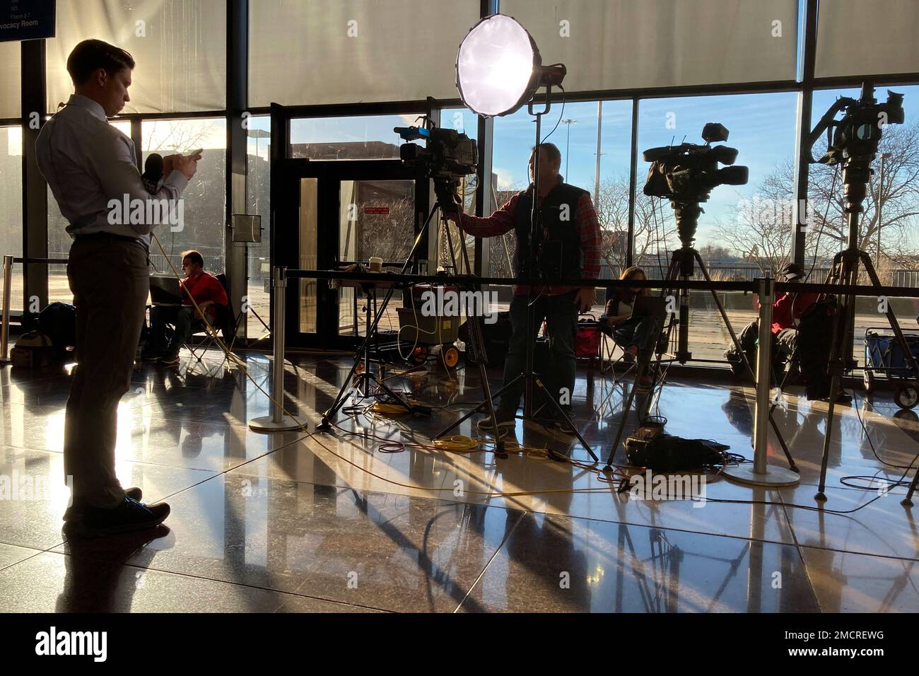Fox News reporter Matt Finn and cameraman Chris Hibben stand in ...