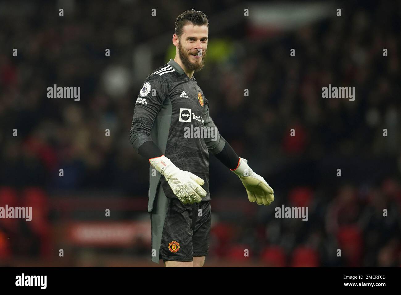 Manchester United's goalkeeper David de Gea smiles after conceding a ...