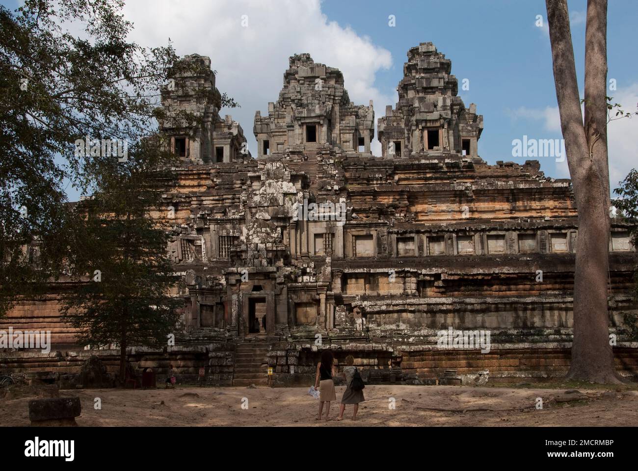 Tourists looking at "unfinished" Ta Keo temple, Angkor complex, Siem ...