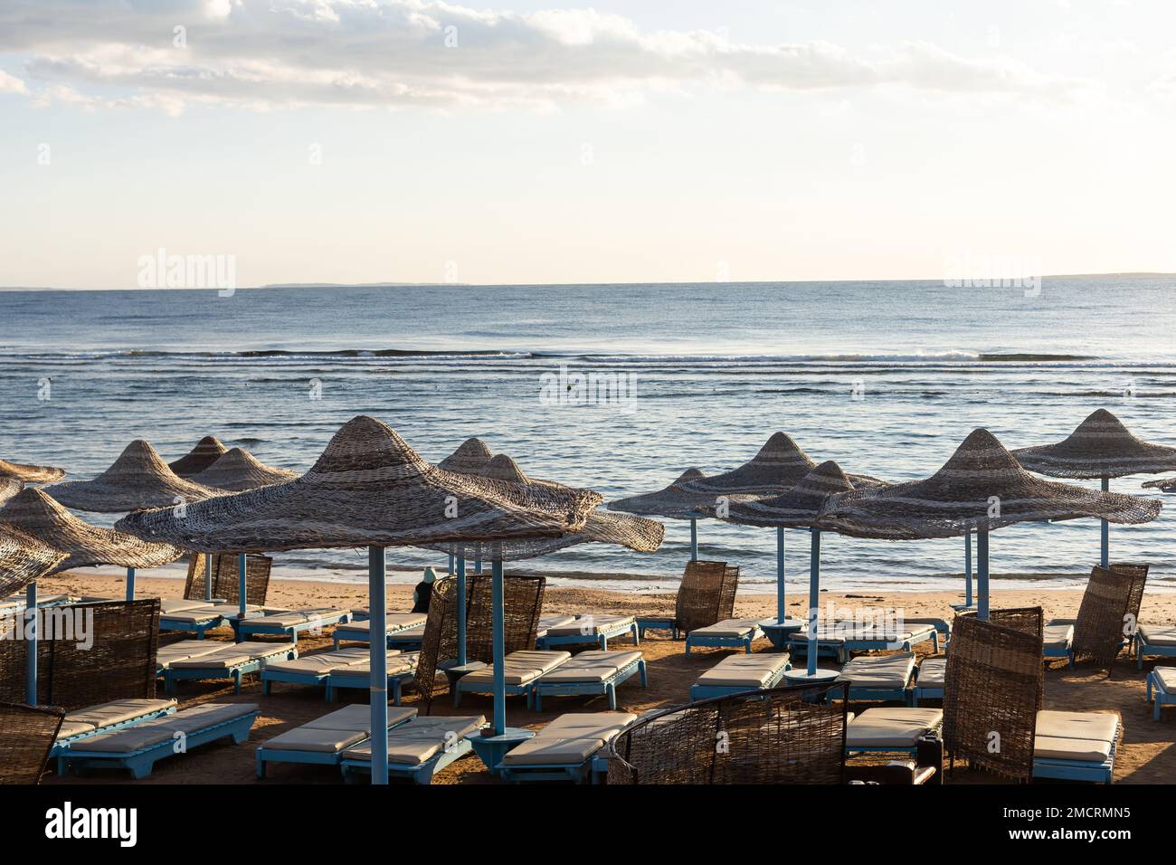 straw beach umbrella with blue sky Stock Photo - Alamy