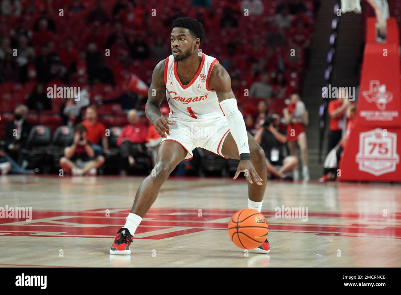 Houston guard Jamal Shead (1) controls the ball against Northwestern ...
