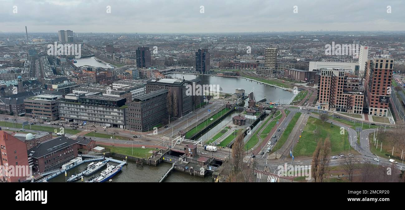 An aerial view of the cityscape with canals and highway roads in ...
