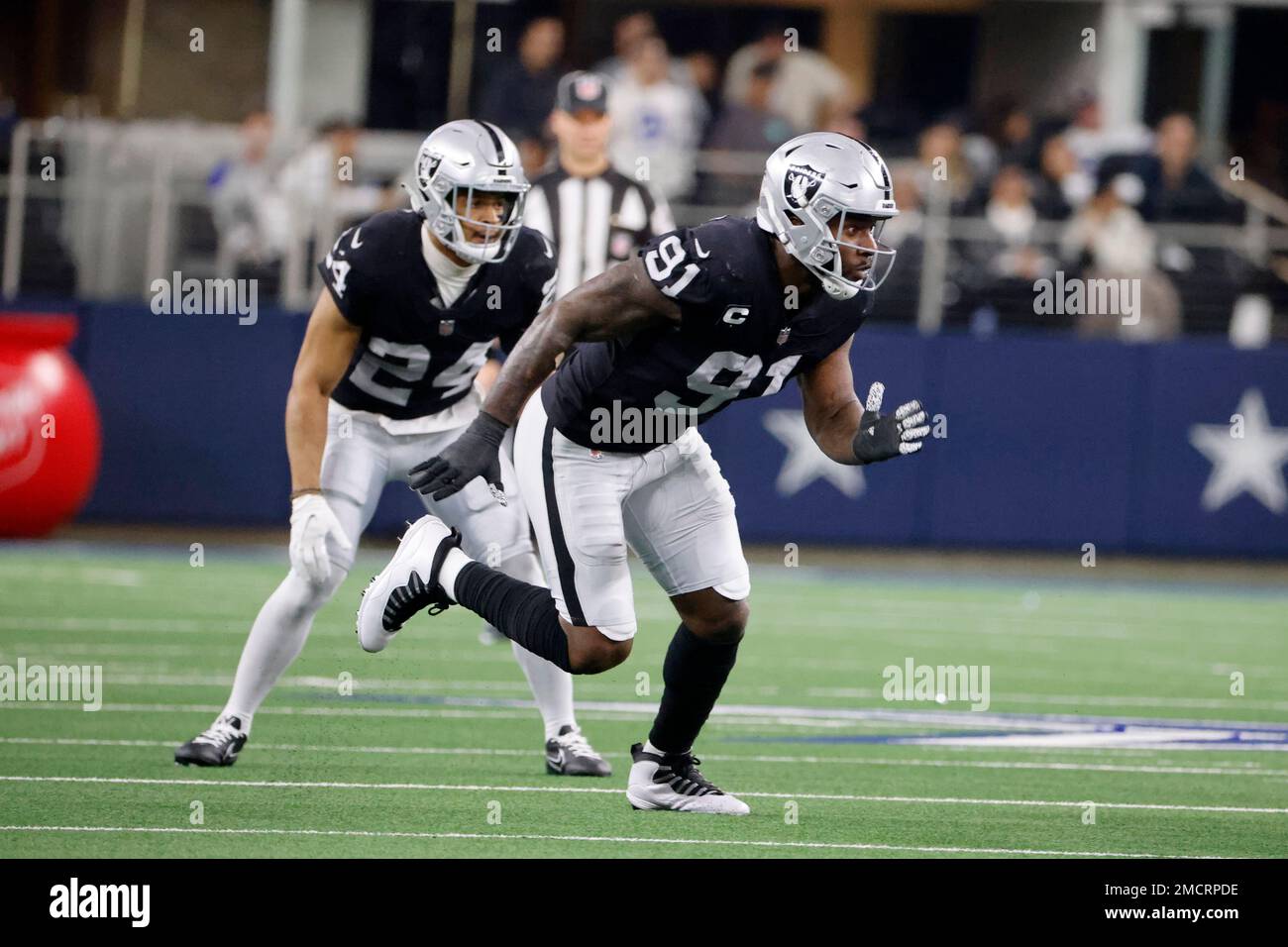 Las Vegas Raiders defensive end Yannick Ngakoue (91) rushes the passer during an NFL Football ...