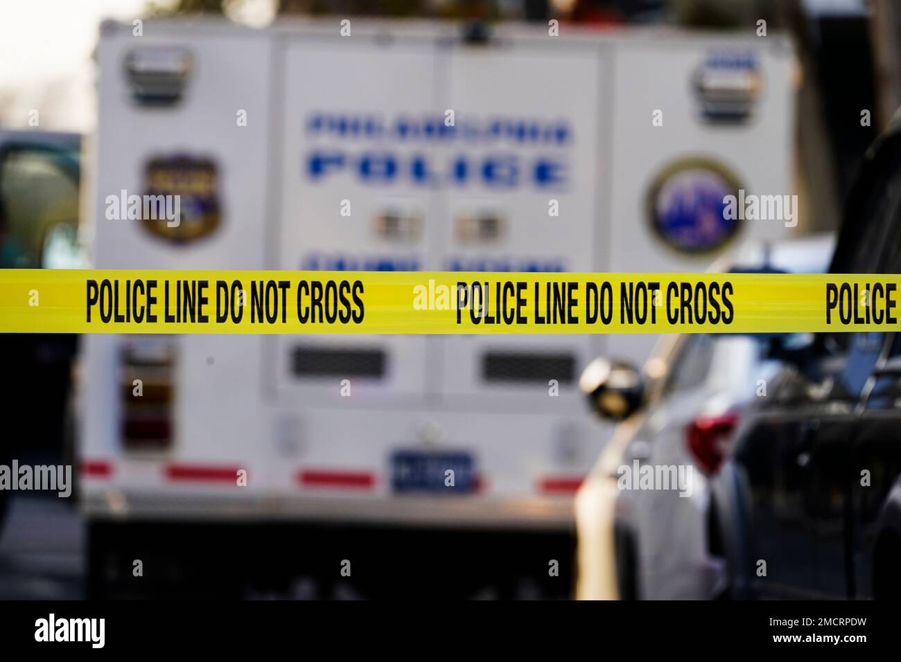 Police tape surrounds the scene of a shooting in Philadelphia ...