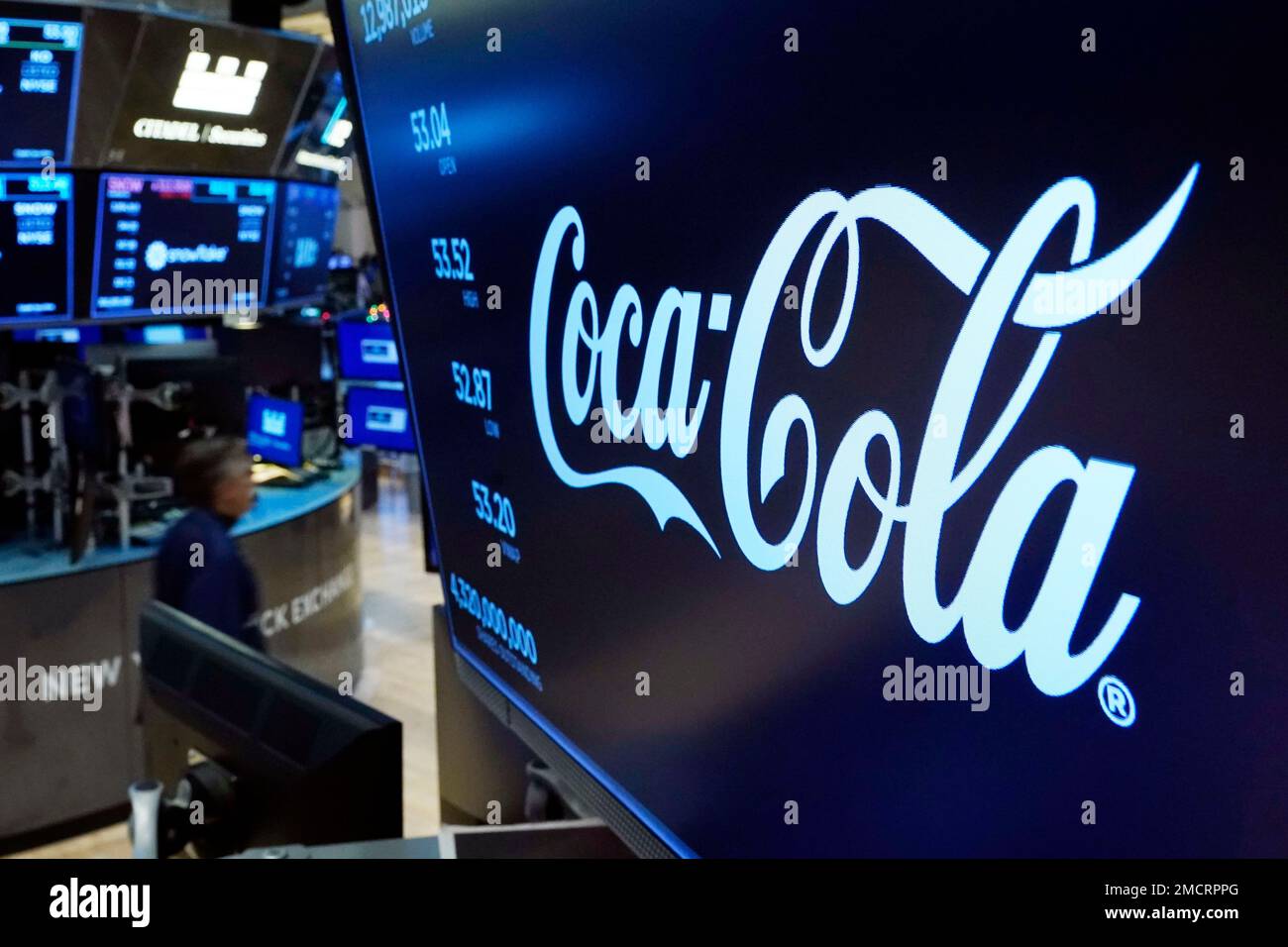 The logo for Coca Cola appears above a trading post on the floor of the ...