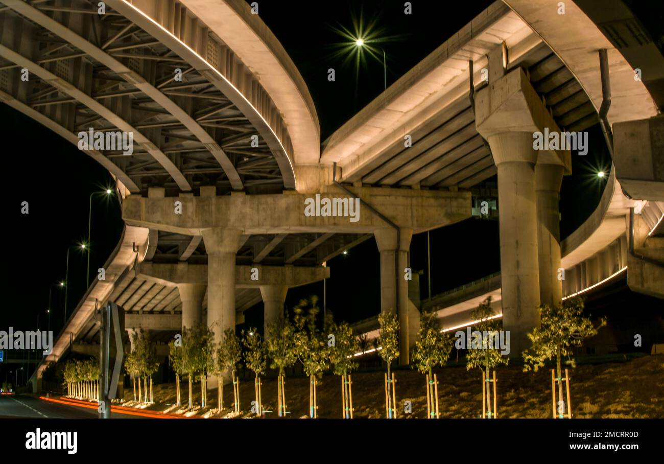 A low angle under trails on the bridge expressway road at night Stock ...