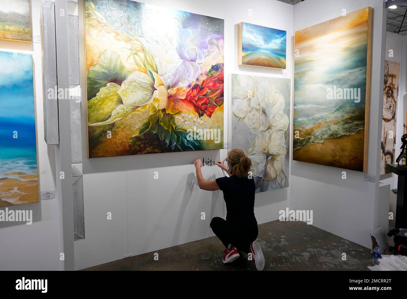 Artist Britten of Vail, Colo., puts the finishing touches to her ...