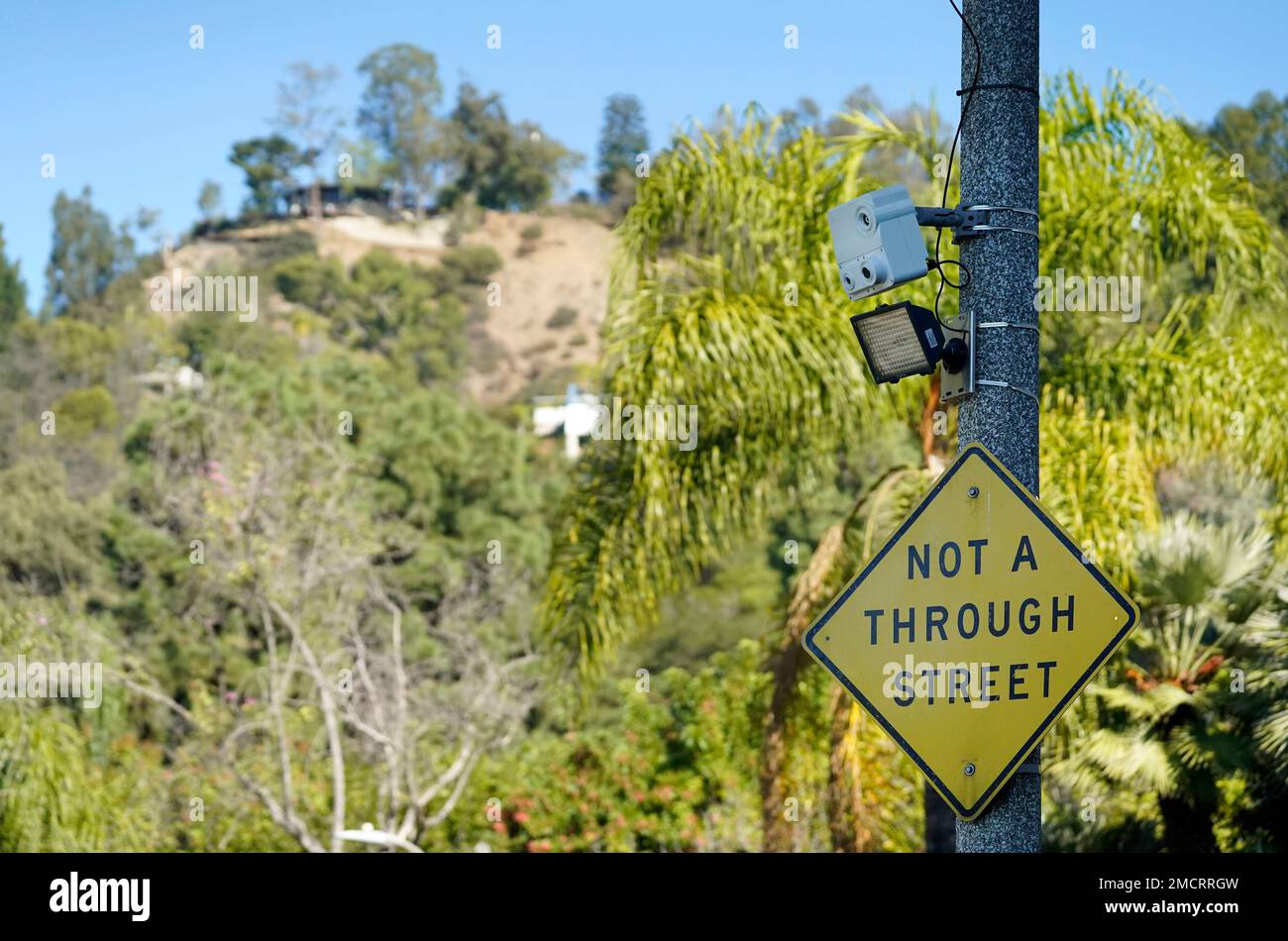 A security camera appears on a telephone pole at the intersection of ...