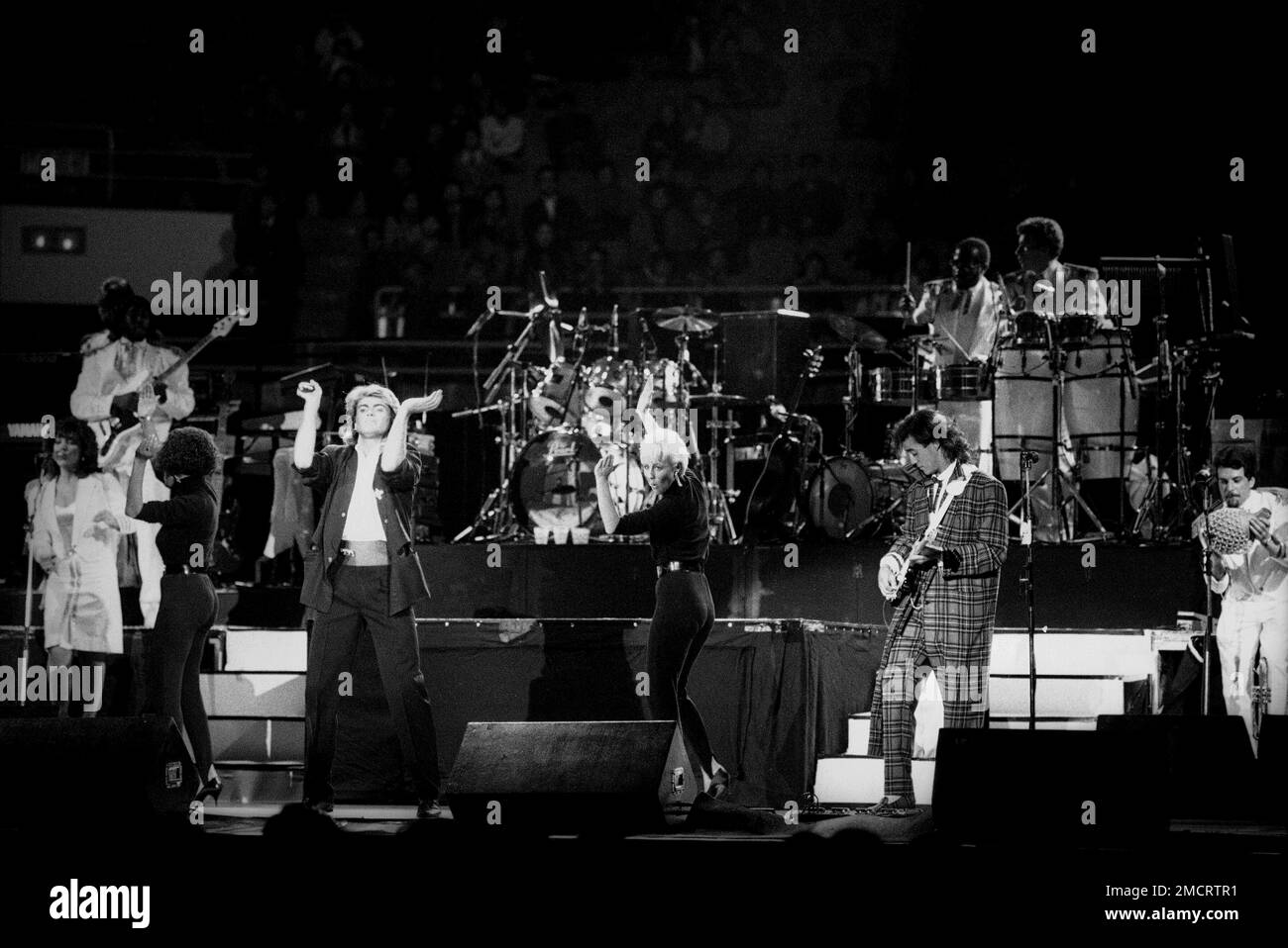 British pop duo Wham! performs on stage in Peking, April 7, 1985. The ...