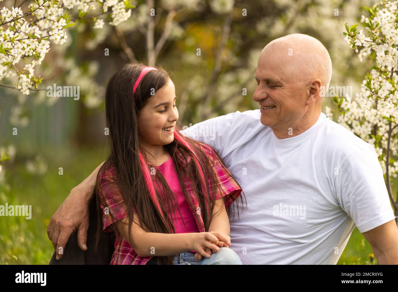 Adorable cute girl and grandfather walk in park Stock Photo - Alamy