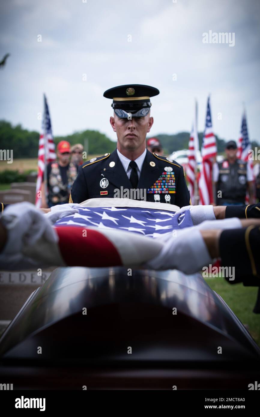 Sgt. Maj. Peter Moeller oversees the folding of the ceremonial flag ...