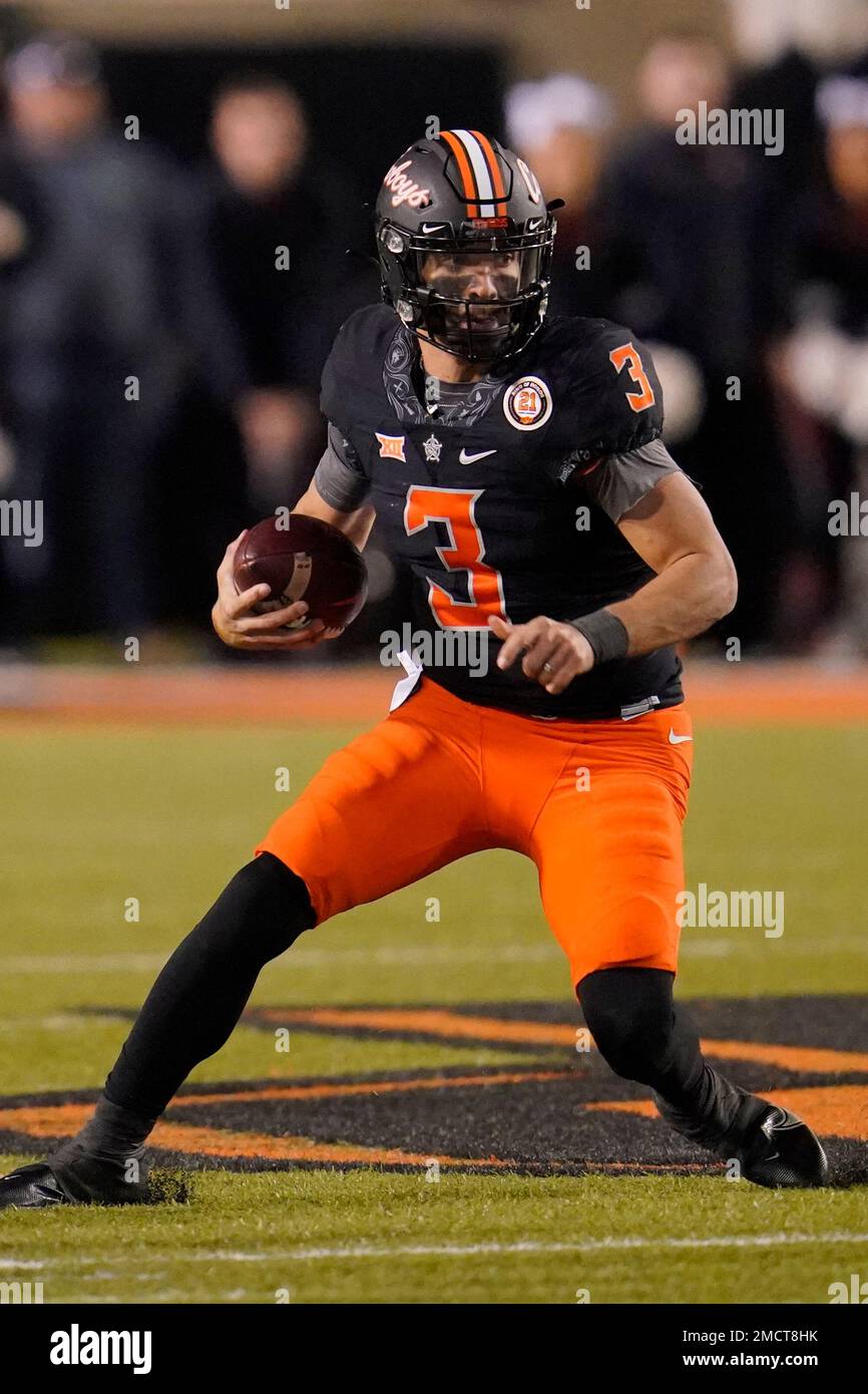Oklahoma State quarterback Spencer Sanders (3) carries during an NCAA ...