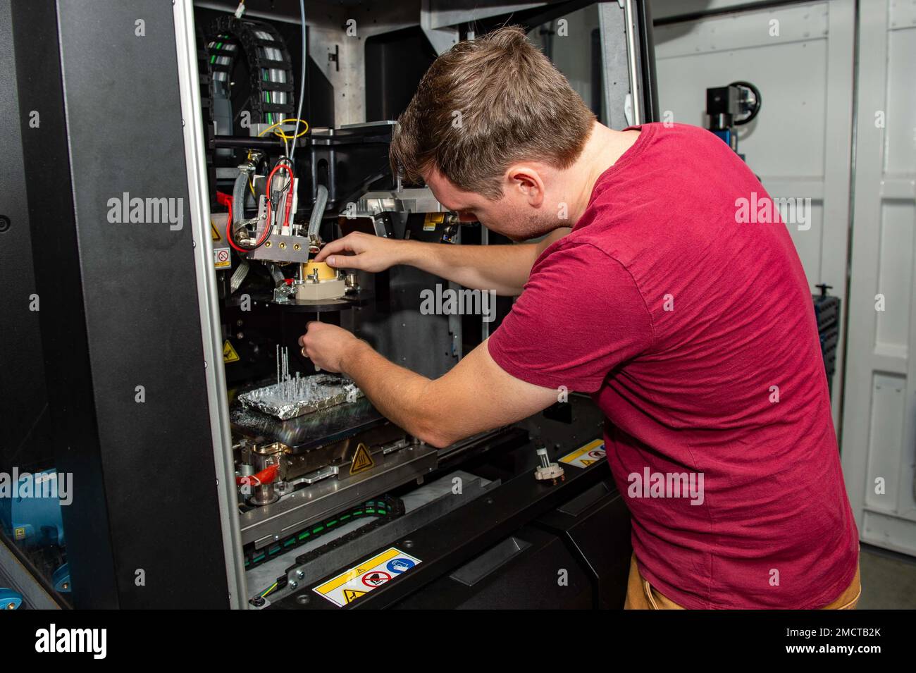 PEARL HARBOR (July 9, 2022) Dan Porter, a Xerox technician assembles a ...