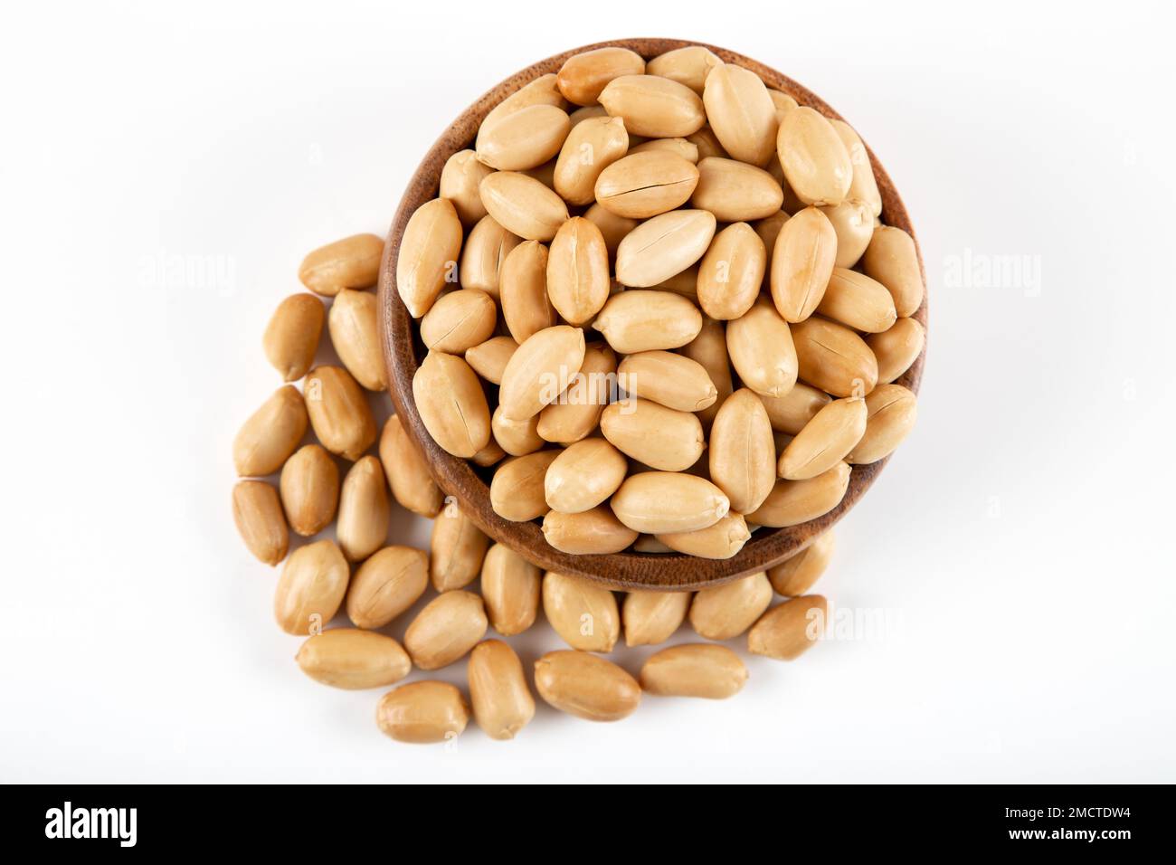 Bowl full of roasted peeled peanuts on wooden background,top view Stock ...