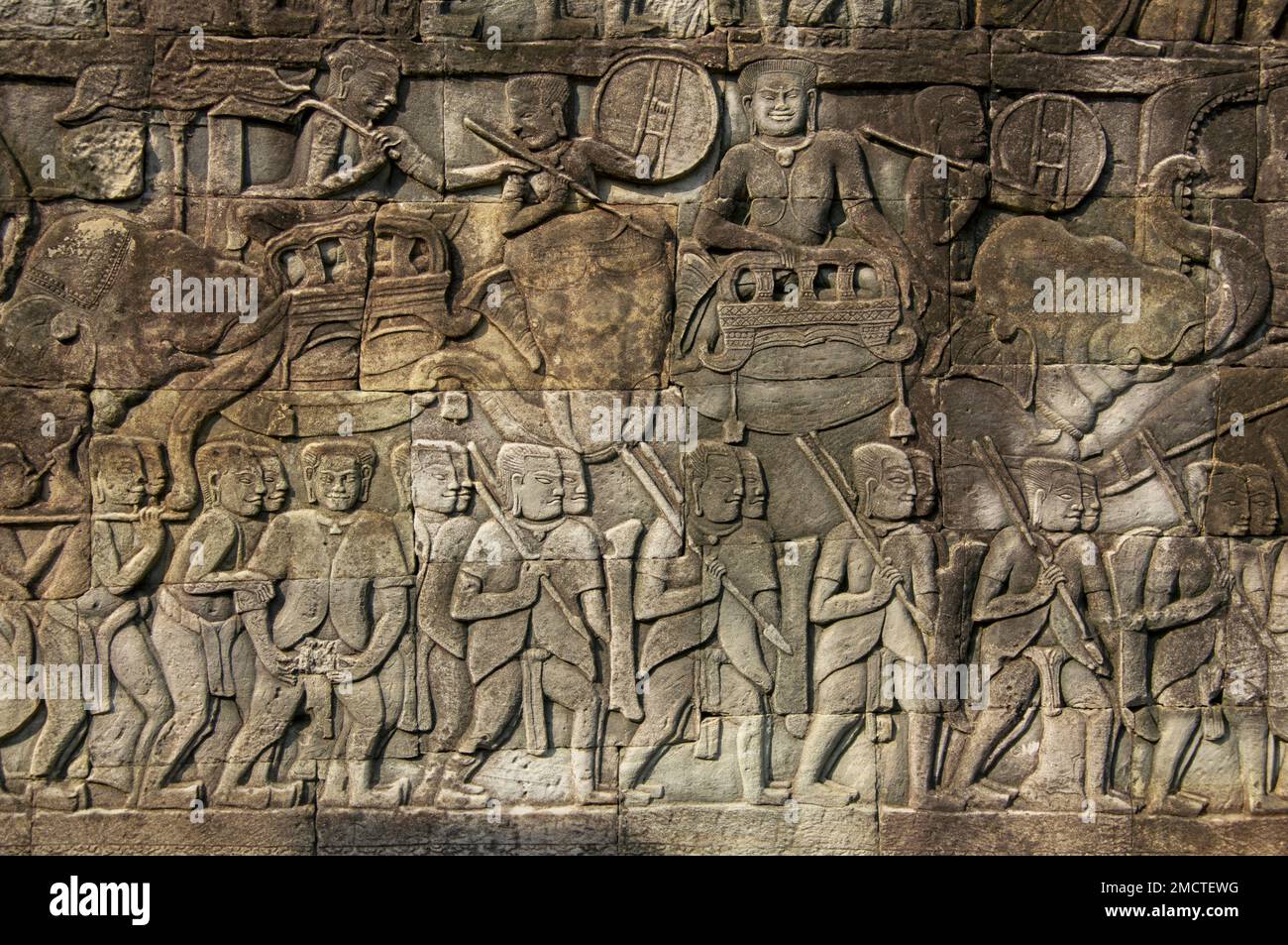 Warriors on elephants in battle between the Cham and Khmer, Bayon ...