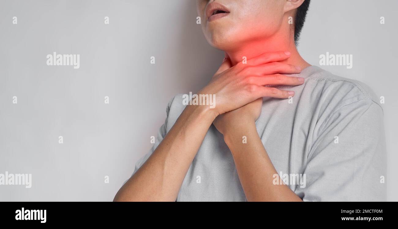 Tightness at the neck of Asian, Myanmar man. Concept of sore throat ...