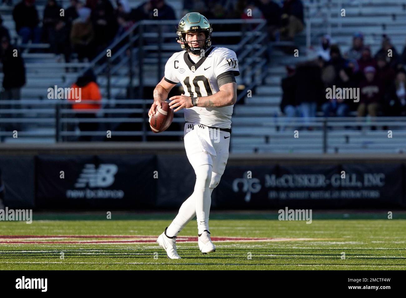 Wake Forest quarterback Sam Hartman (10) scrambles as he looks to pass ...