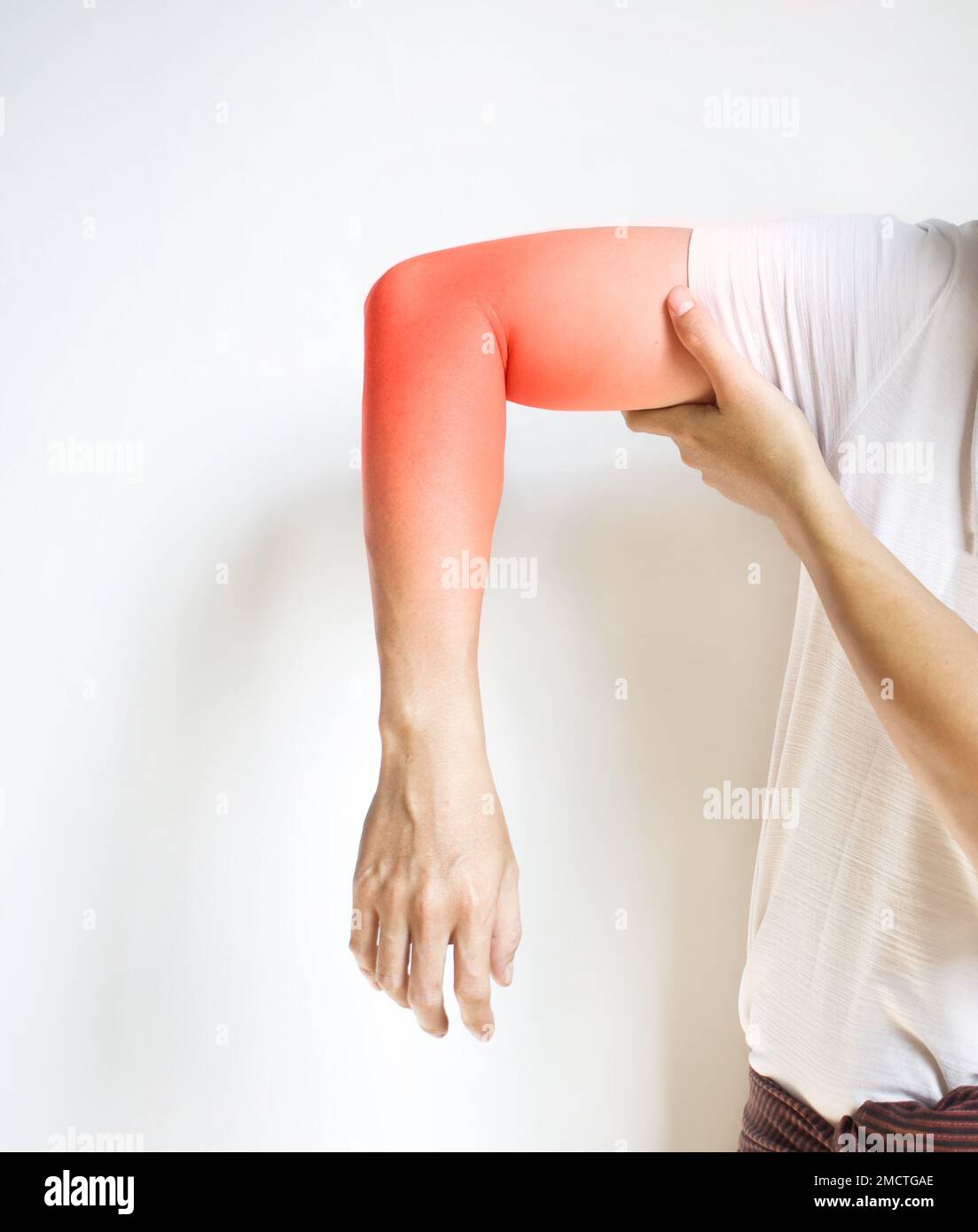 Pain in the upper arm of Southeast Asian young man. Concept of elbow ...