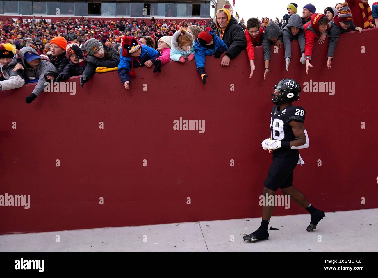 Iowa State running back Breece Hall (28) makes his way to the field ...
