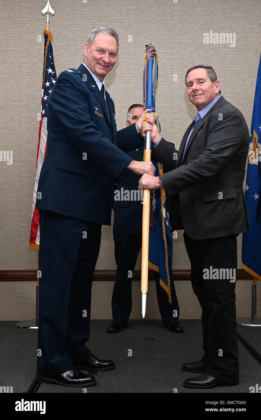 Col. Terry McClain, 433rd Airlift Wing commander, hands the 433rd AW ...