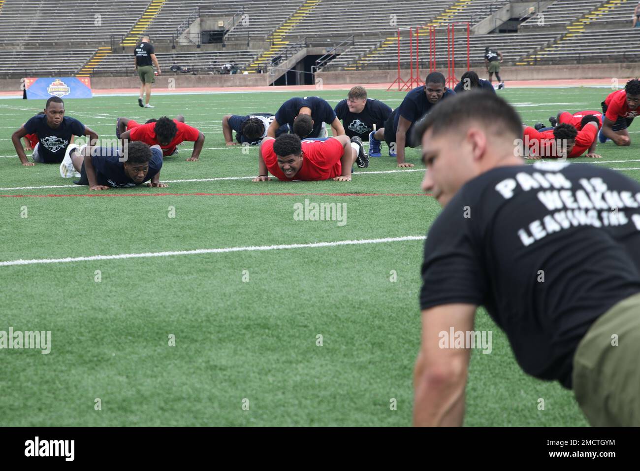 High School athletes push themselves while doing Marine Corps push-ups ...