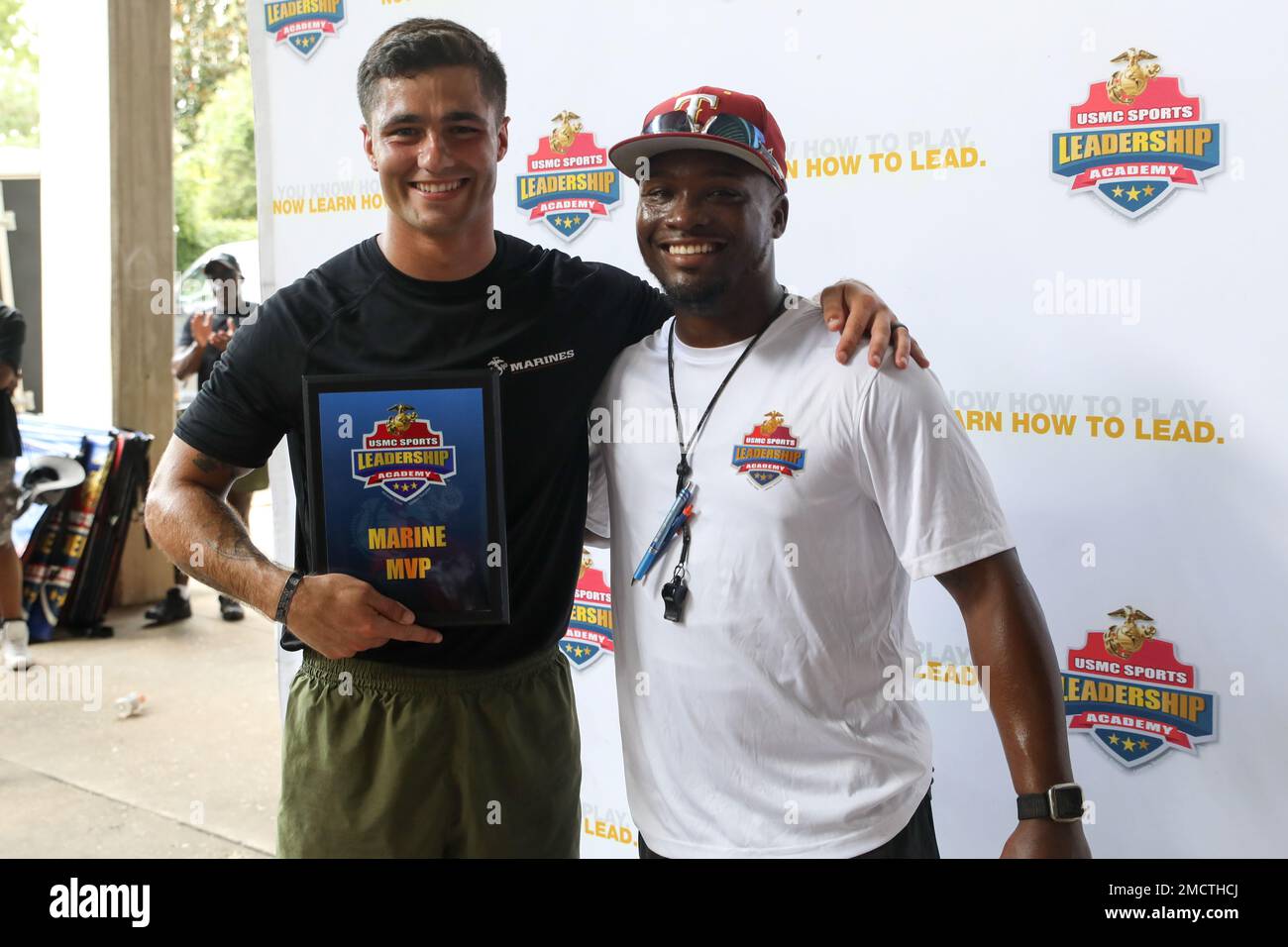Tyler Lewis, a football coach with Terrebonne high school, awards U.S ...