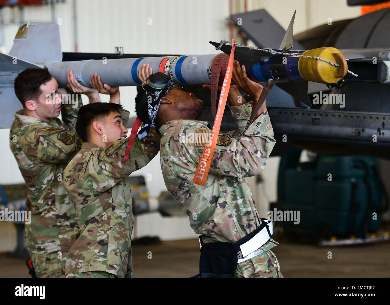 Staff Sgt. Shawn Harris, 80th Fighter Generation Squadron weapons load ...