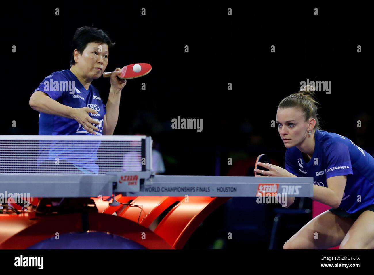 Luxembourg's Xia Lian Ni, left, serves next to Sarah De Nutte, right ...