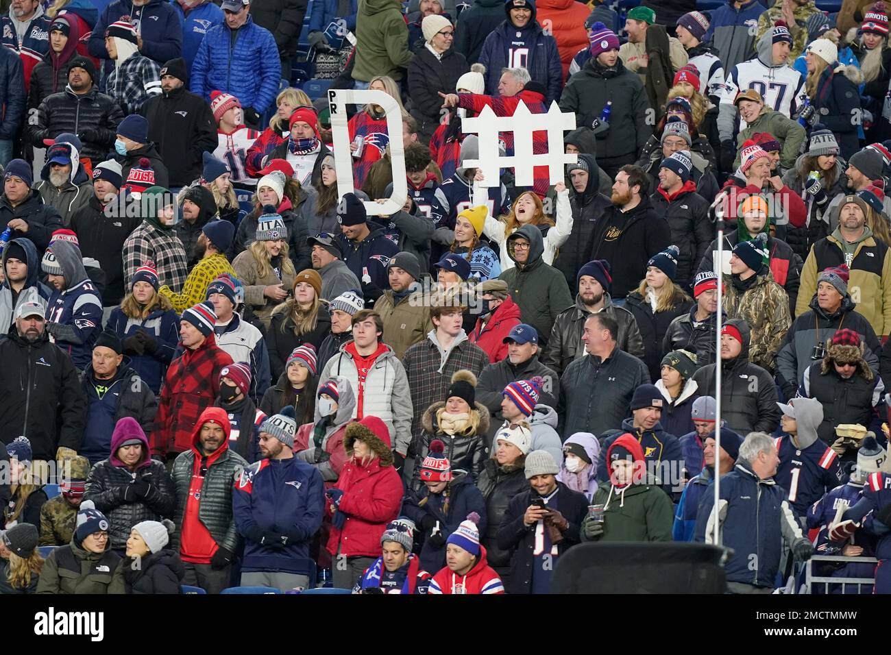 New England Patriots fans hold up a defense sign during the second half ...