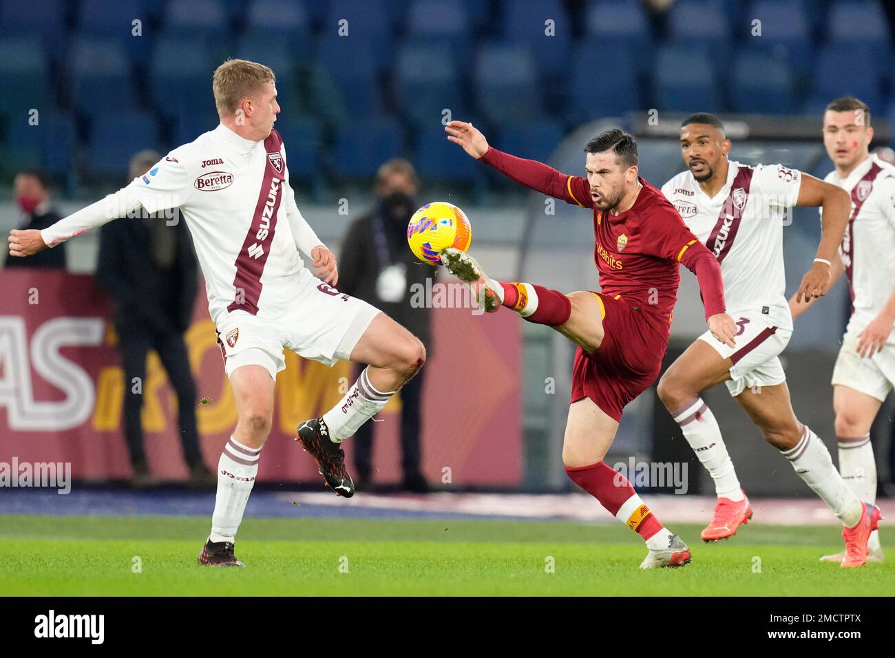 Torino's David Zima, left, challenges Roma's Carles Perez during the ...