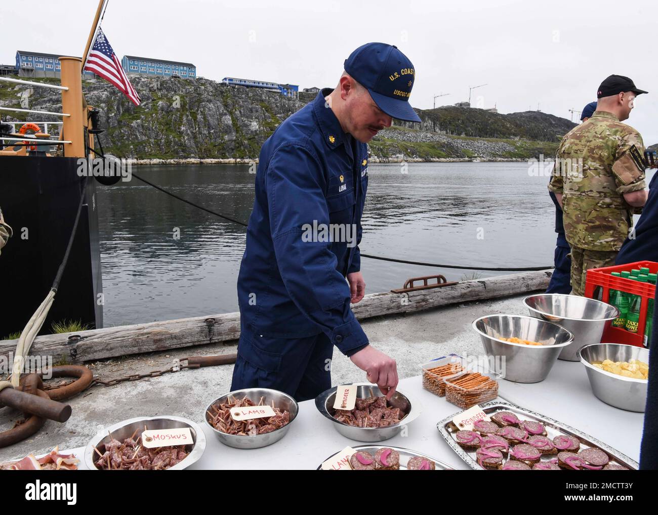 USCGC Oak (WLB 211) commanding officer Lt. Cmdr. Jacob Loman samples ...
