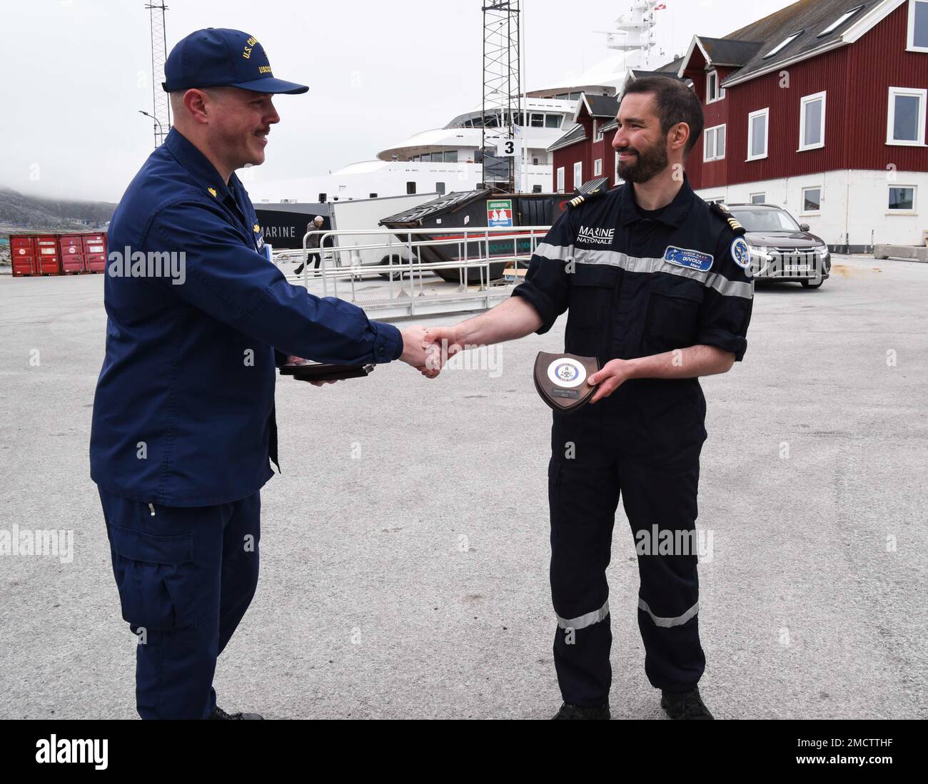 USCGC Oak (WLB 211) commanding officer Lt. Cmdr. Jacob Loman presents ...