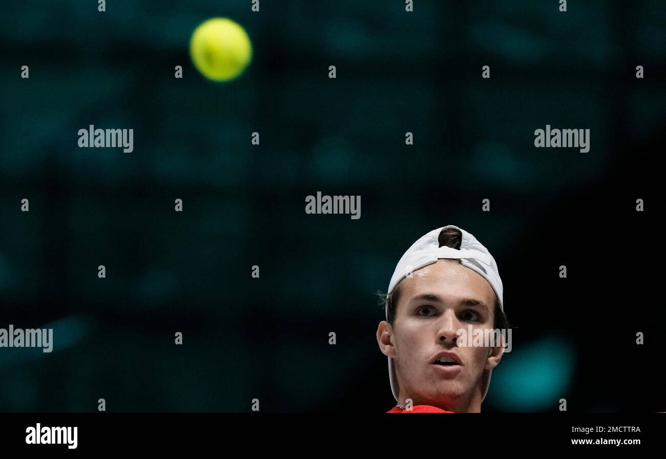 Hungary's Zsombor Piros returns the ball to Croatia's Marin Cilic ...