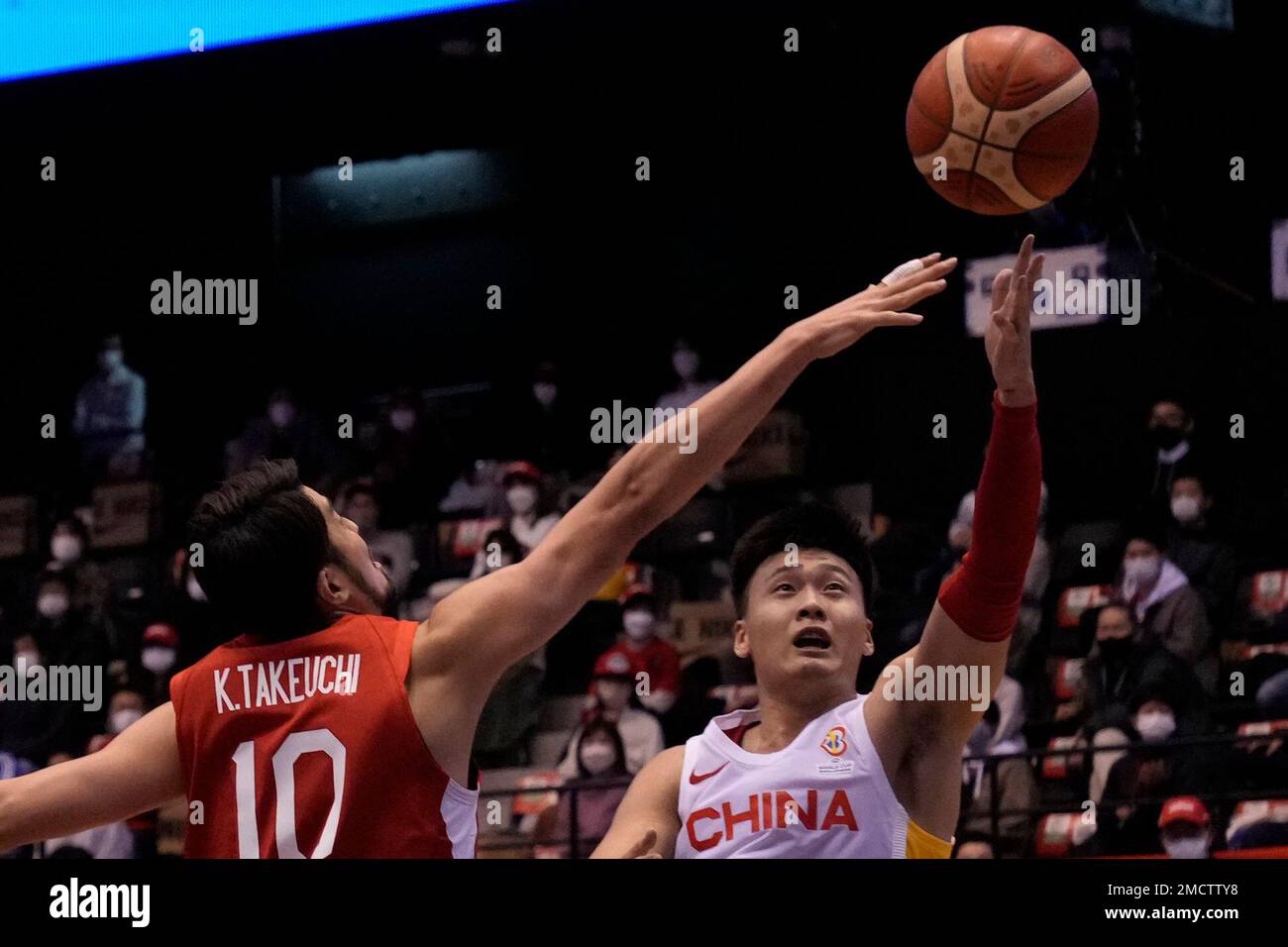 China's Zhao Rui, right, competes for a rebound against Japan's Kosuke ...