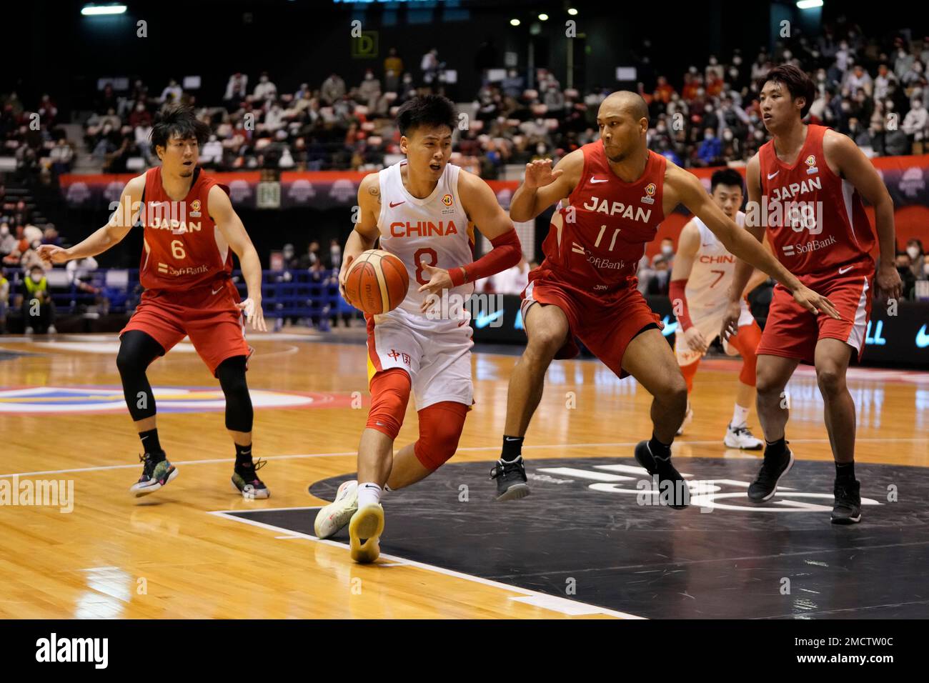 China's Zhao Rui (8) drives to the basket against Japan's Aki Chambers ...