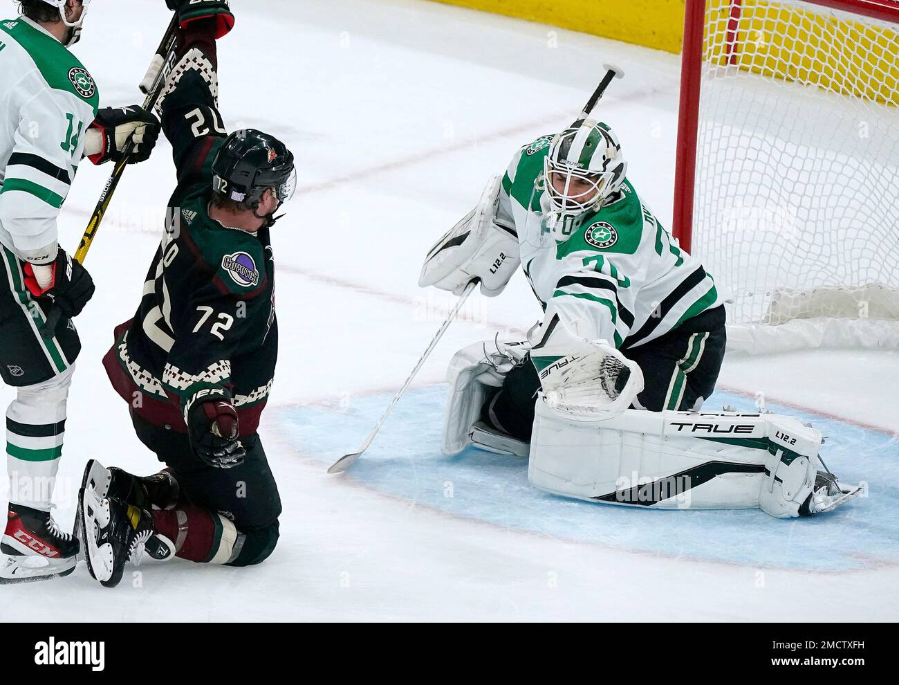 Dallas Stars goalie Branden Holtby (70) makes a glove save in front of ...