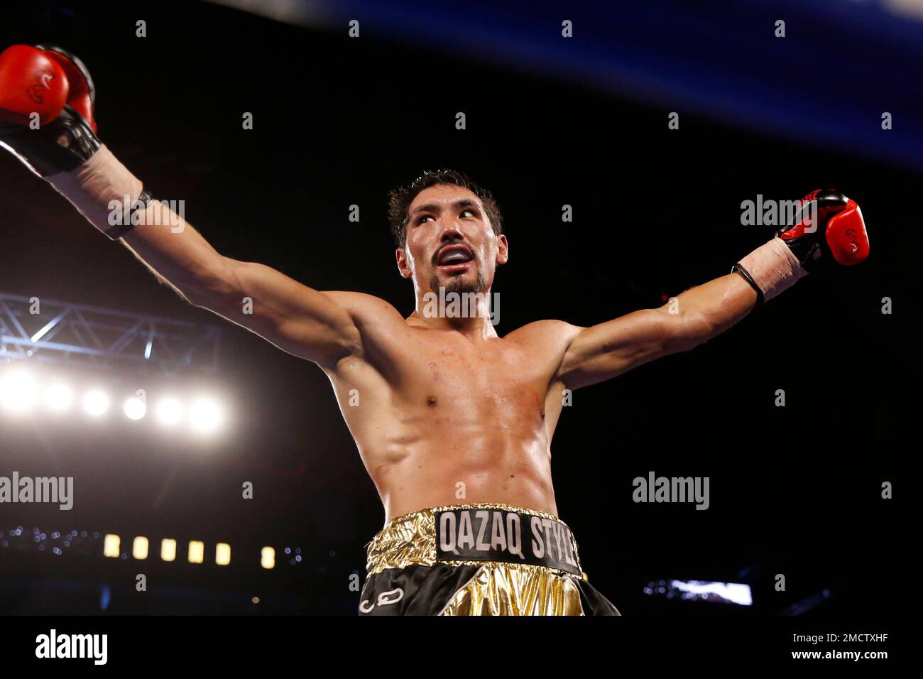 Janibek Alimkhanuly, of Kazakhstan, celebrates after defeating Hassan N ...