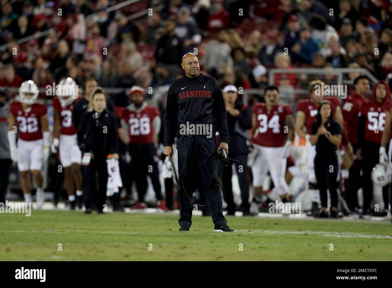 Stanford coach David Shaw stands on the field against during the first ...
