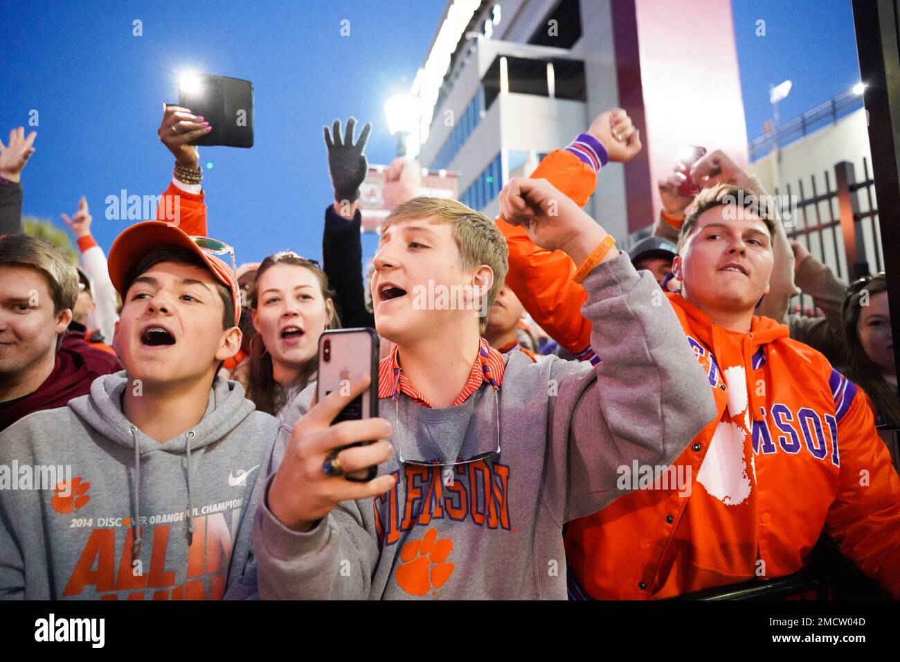Clemson fans cheer on the Tigers as they arrive at Williams-Brice ...