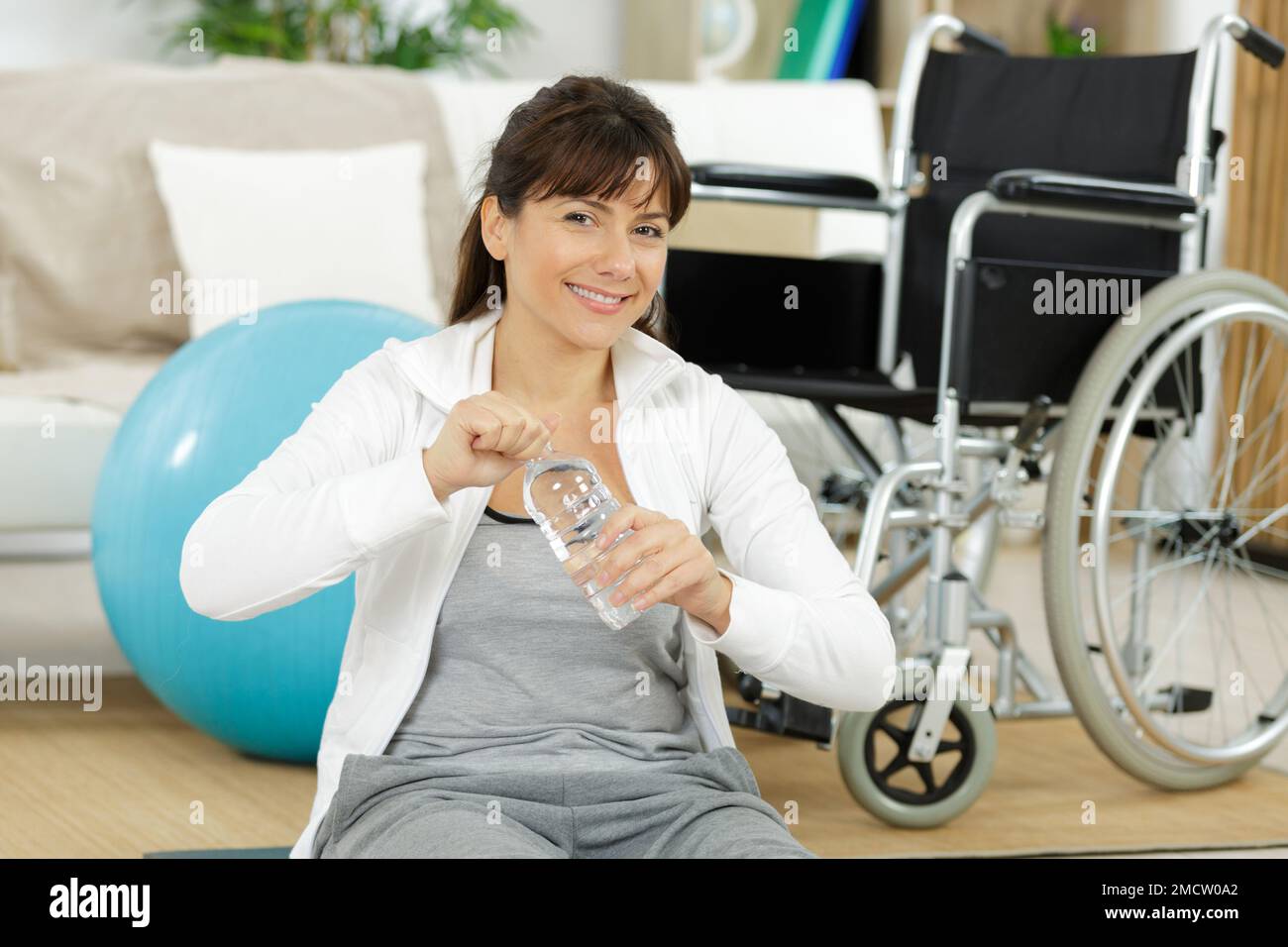 a handicapped woman in a wheelchair Stock Photo - Alamy