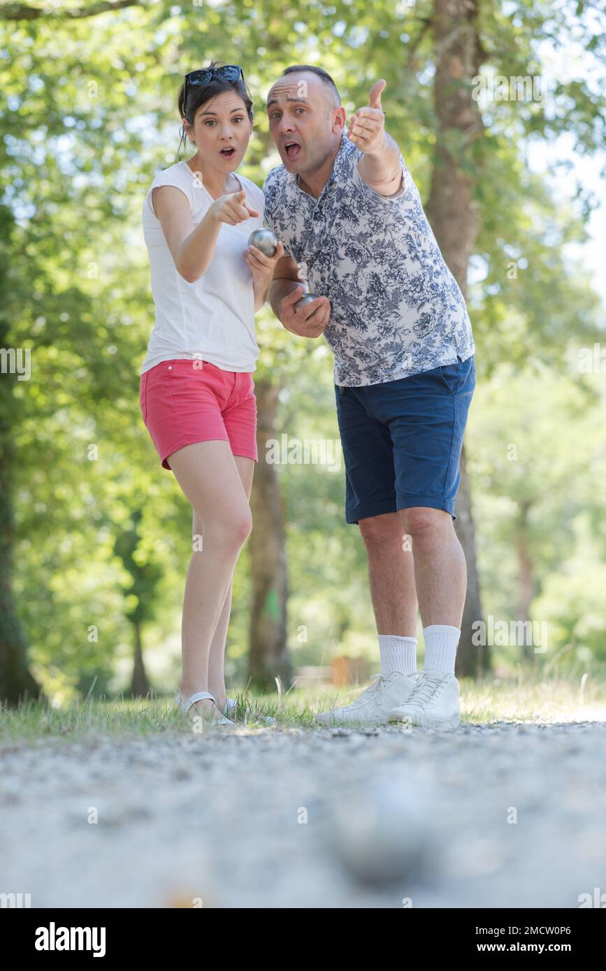 couple arguing during game of petanque Stock Photo - Alamy