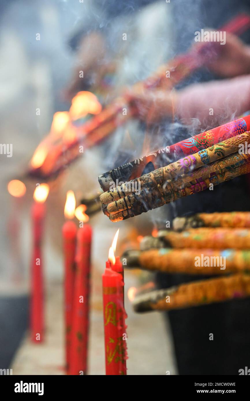 People burn incense and pray for good luck at the Zifu Temple in Fuyang ...