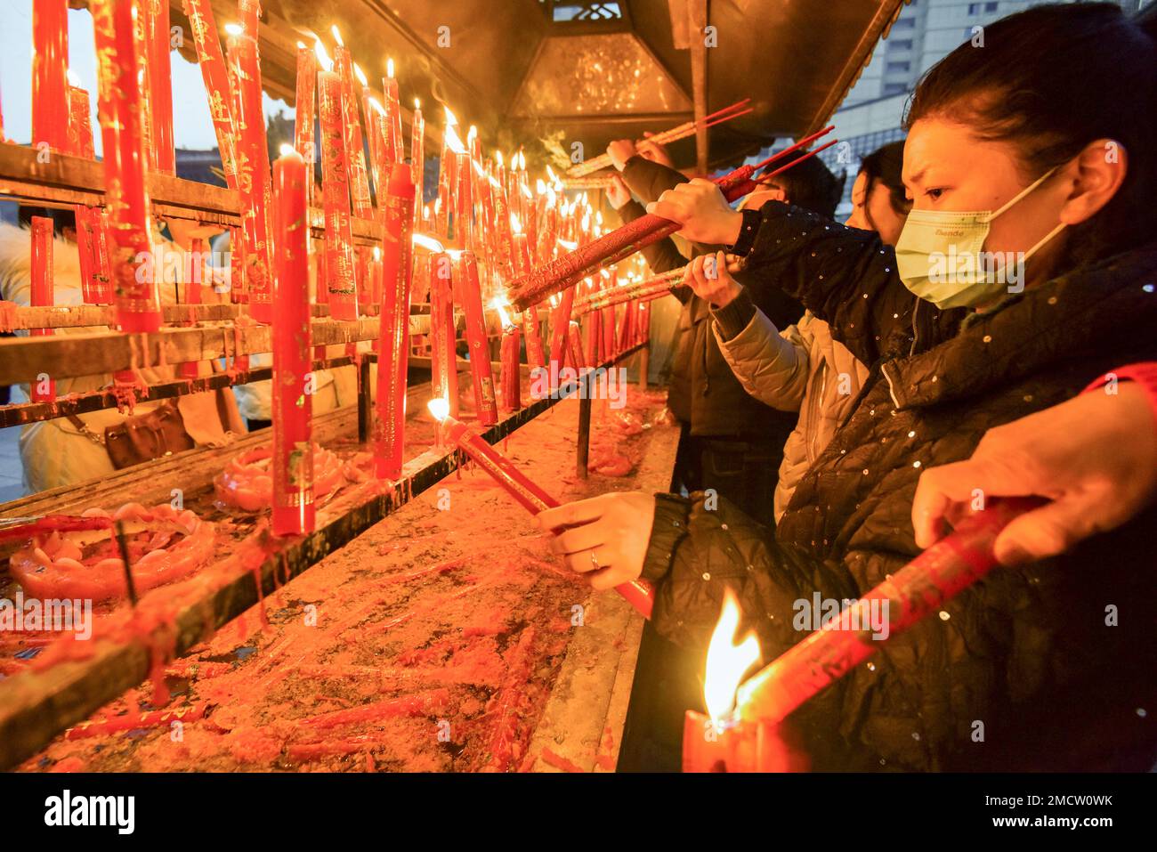 People burn incense and pray for good luck at the Zifu Temple in Fuyang ...